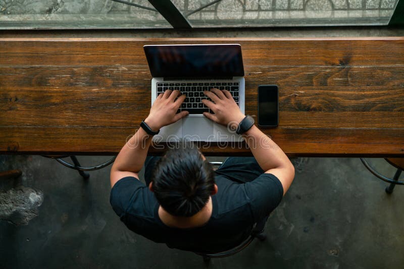 Man Wearing Two Smart Watch and Using Laptop Stock Photo - Image of ...