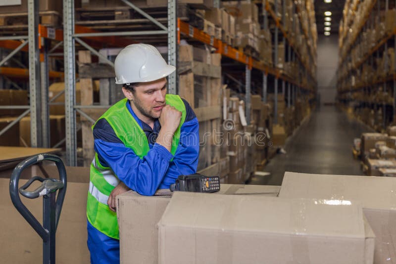 Man Wearing Uniform Leaning upon Boxes Stock Photo - Image of container ...
