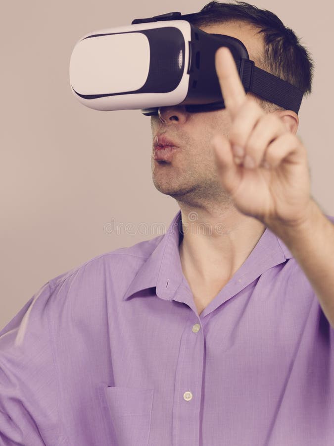 Man Wearing Virtual Reality Goggles on Grey Stock Photo - Image of ...