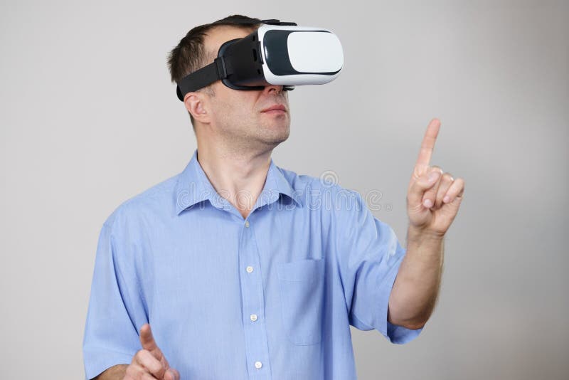 Man Wearing Virtual Reality Goggles on Grey Stock Image - Image of ...