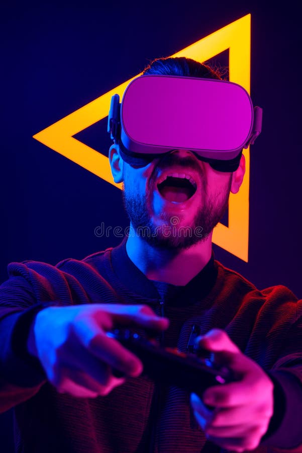 Man Wearing Virtual Reality Goggles Playing Video Game with Gamepad Joy ...