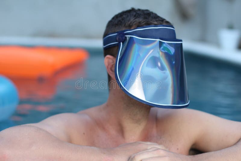 Man Wearing Visor with Woman Sitting on His Lap Stock Photo - Image of ...