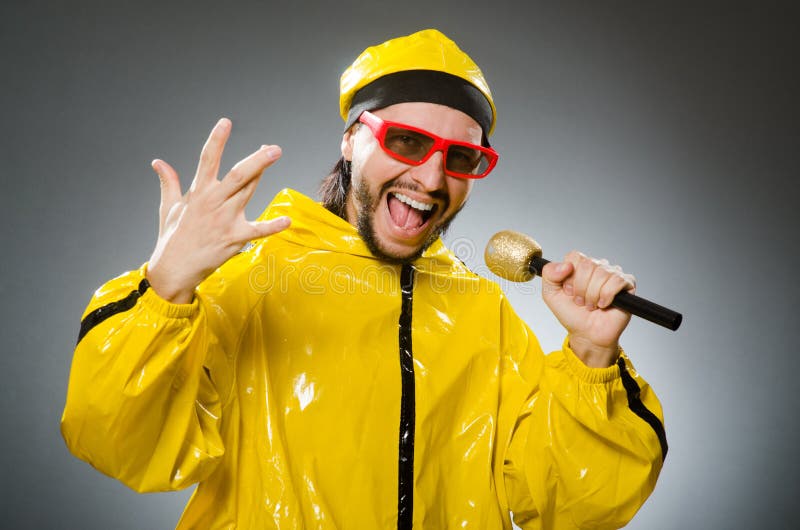 Man Wearing Yellow Suit with Mic Stock Photo - Image of entertainer ...