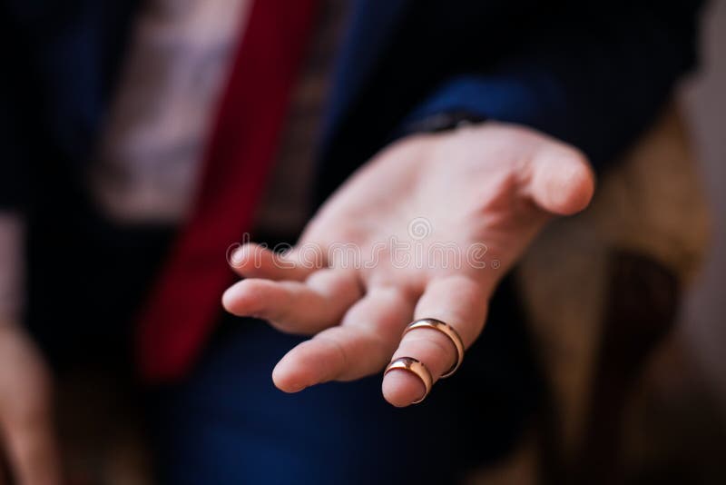 Man with a Wedding Ring. Groom Holding Two Rings Stock Photo - Image of ...