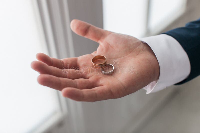 Groom Holding Two Rings on the Palm Stock Image - Image of bride ...