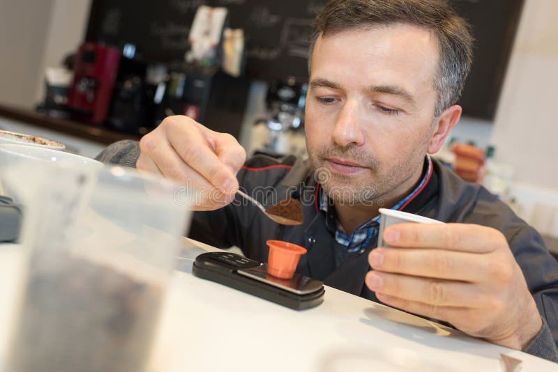 Man weighing coffee powder stock photo. Image of produce - 309076996