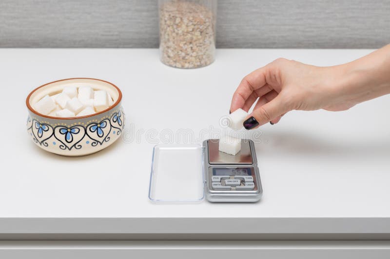Weighing sugar on scale. stock photo. Image of white - 16504984 Weighing sugar on scale. stock photo. Image of white - 16504984