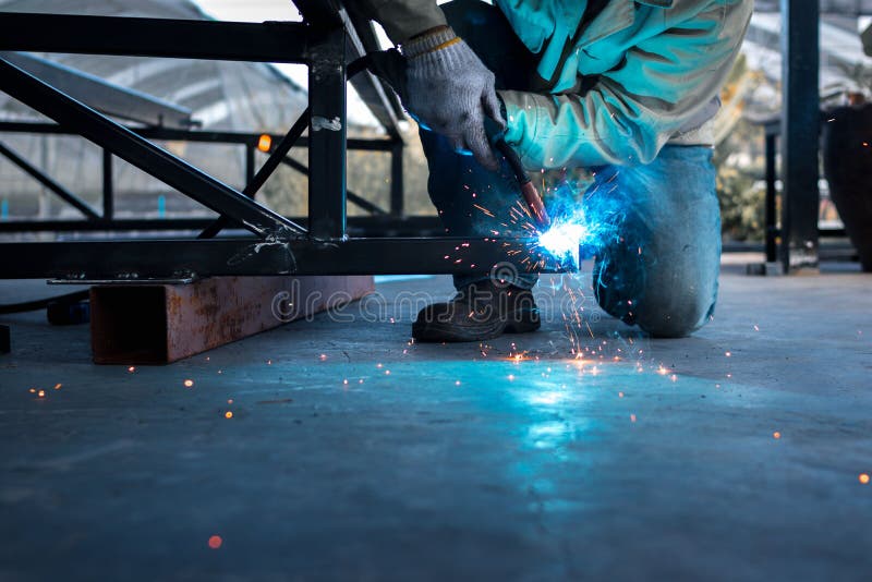 A Man Welder in Uniform is Working Stock Photo - Image of protection ...