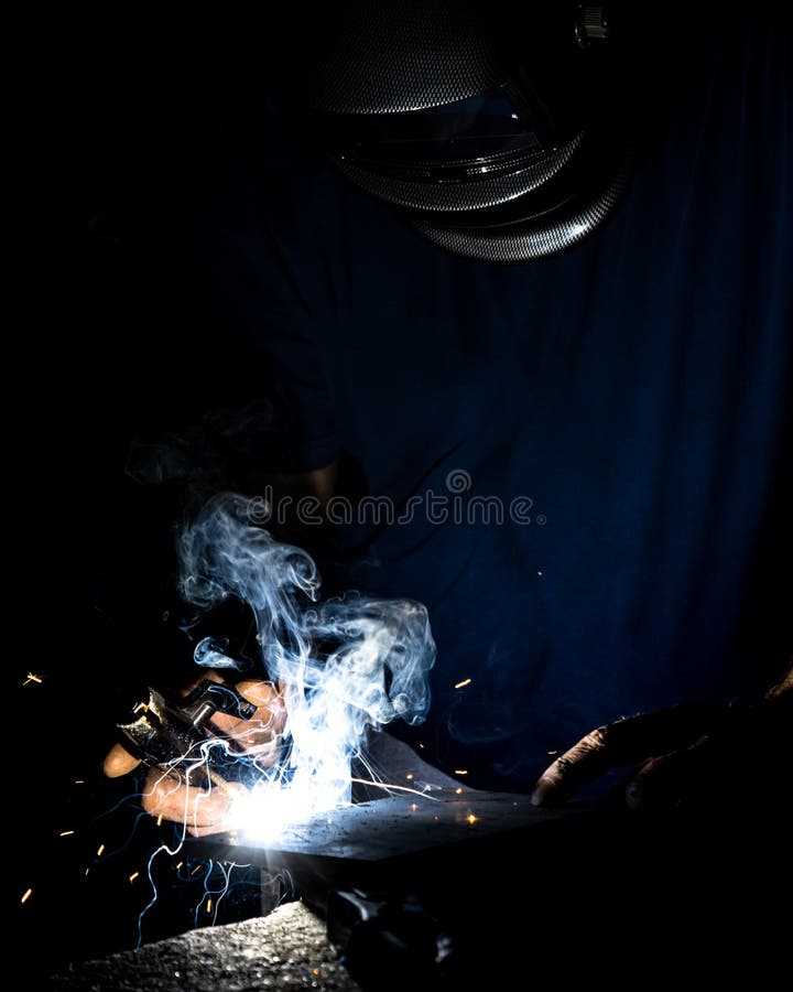 Man Welding Iron with a Protective Mask Stock Photo - Image of metal ...