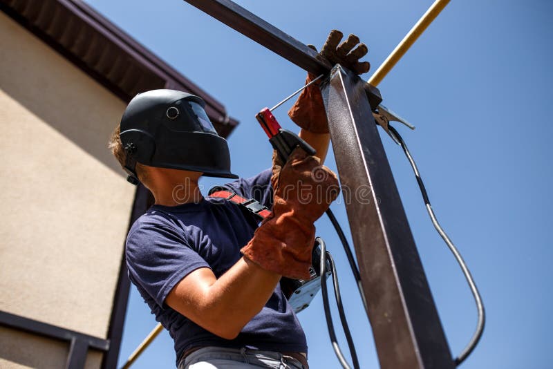 Man Welding Metal Construction at His Backyard. Stock Photo - Image of ...