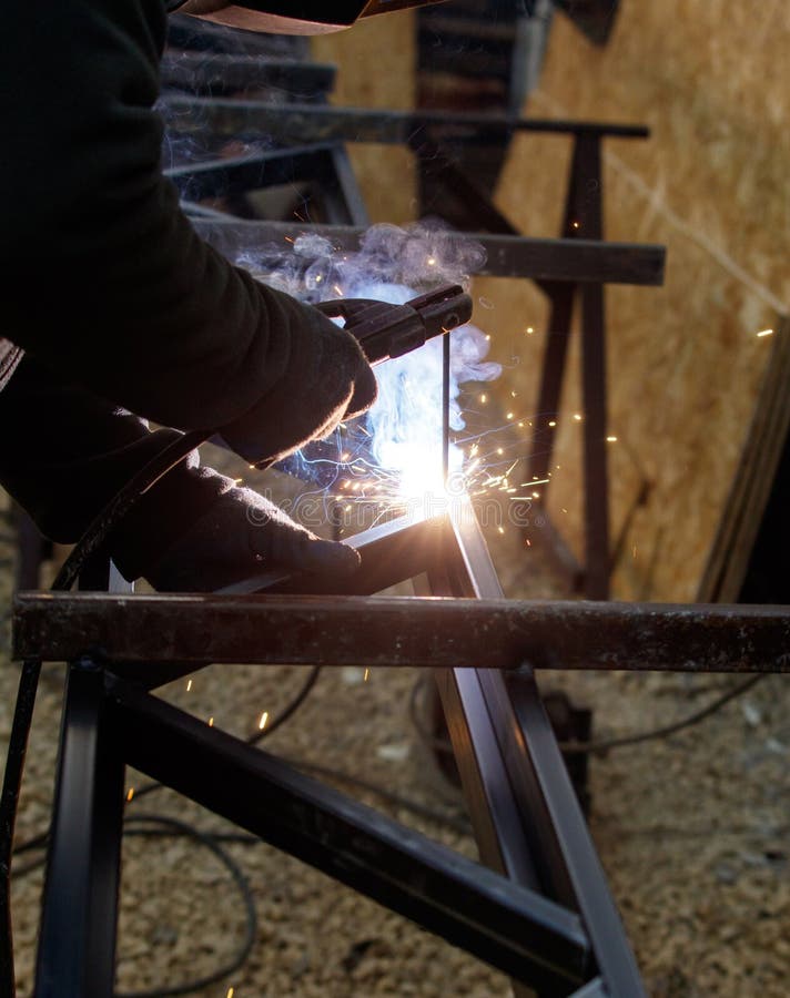 A Man is Welding Metal with a Torch Stock Photo - Image of factory ...