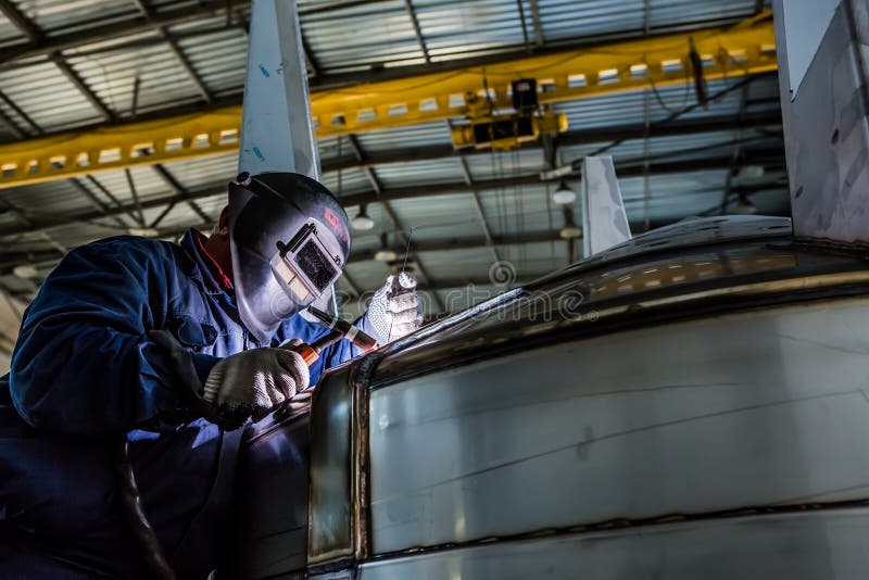 Man Welding with Reflection of Sparks on Visor Stock Photo - Image of ...