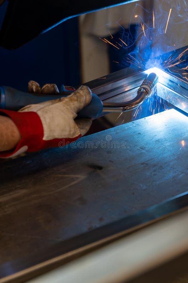 Man Welding Steel Frames in a Forgery and Metal Works Workshop Stock ...