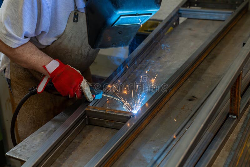 Man Welding Steel Frames in a Forgery and Metal Works Workshop Stock ...
