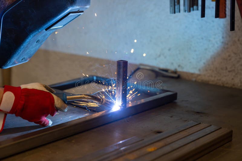 Man Welding Steel Frames in a Forgery and Metal Works Workshop Stock ...