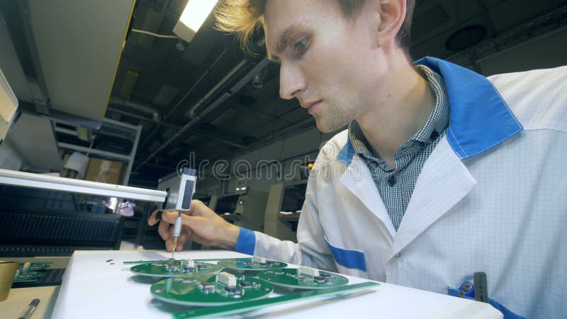 One Worker Welds Chip, Microcircuit, Microchip, Integrated Circuit ...