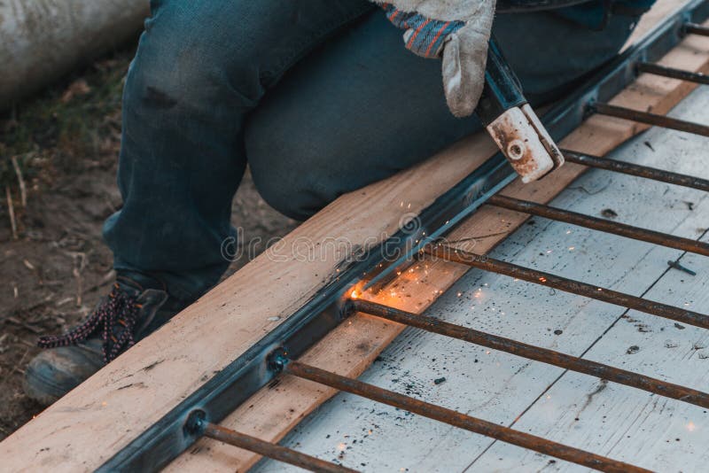 A Man Welds a Metal Frame To Build an Aviary, Welding Metal Close Up ...