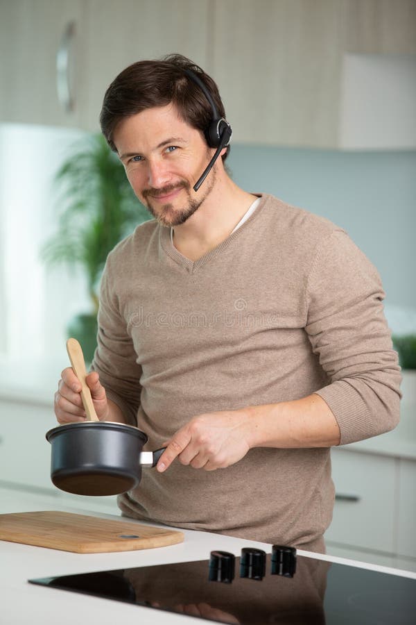 Man Weraing Headset Cooking while Working Stock Photo - Image of ...