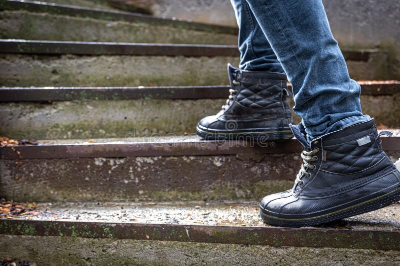 A Man in Boots on the Old Steps, Close-up. Stock Photo - Image of ...