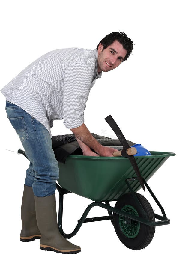 Man with a wheelbarrow stock photo. Image of pickax, labour - 29386322