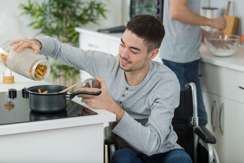 Man on Wheelchair Cooking Meal Stock Image - Image of taste, motion ...