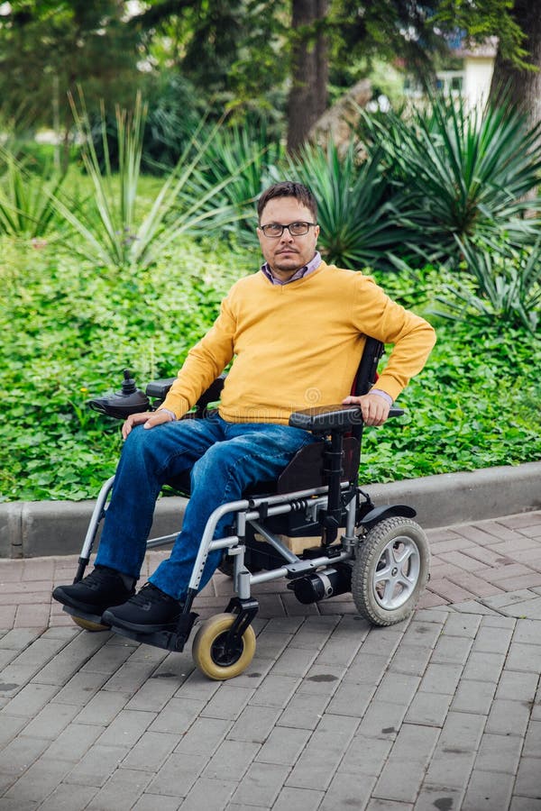 A Man with Disabilities in a Wheelchair Enjoys Life Stock Image - Image ...