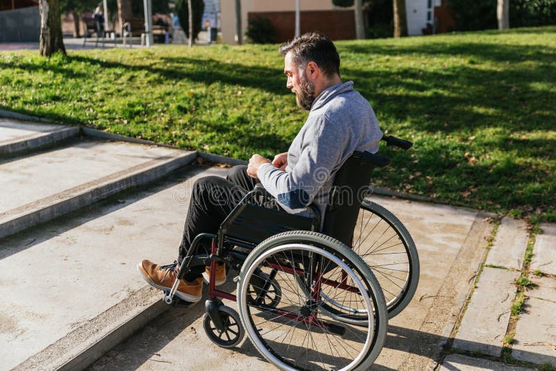 Man in a Wheelchair Facing Accessibility Problem in Front of the Stairs ...