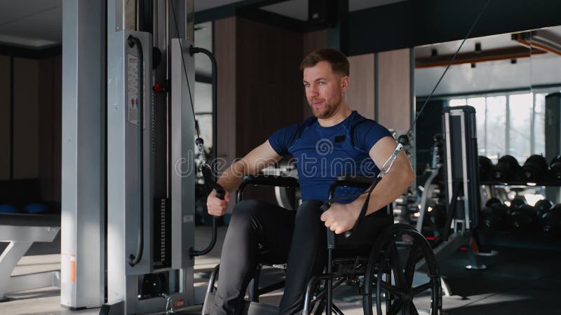Man in Wheelchair Performing Cable Crossover Exercise Stock Video ...