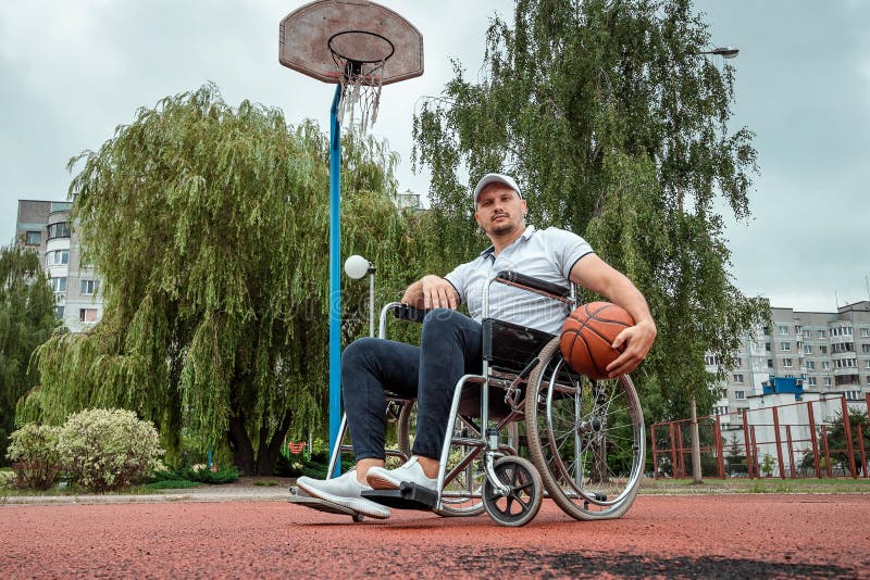 Dad Plays With His Disabled Son On The Sports Ground Concept
