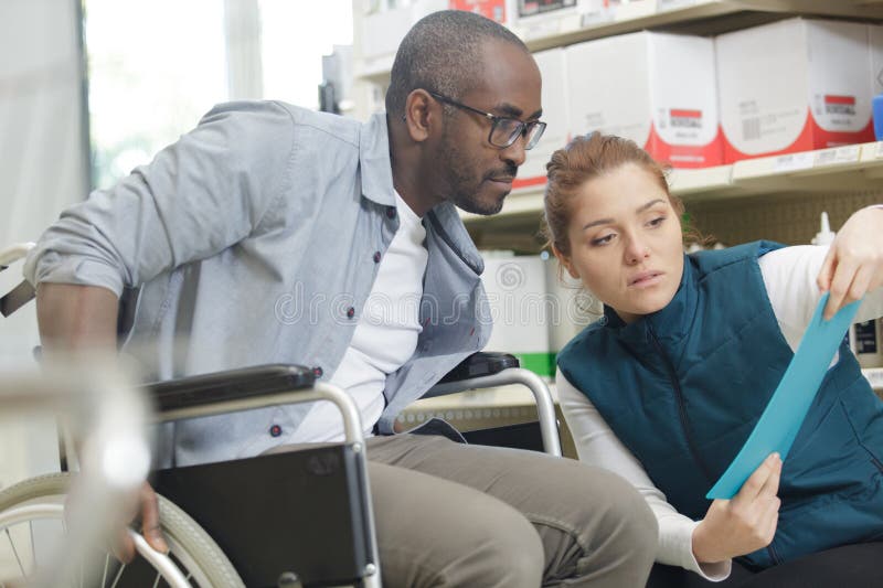 Man in Wheelchair Shopping in Hardware Store Stock Photo - Image of ...