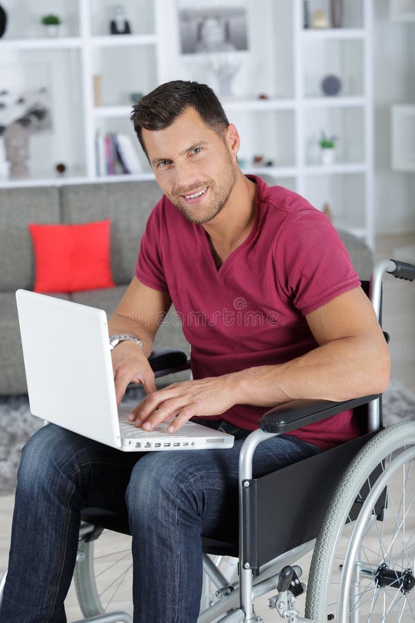 Man in a Wheelchair Using a Computer Stock Image - Image of smile ...