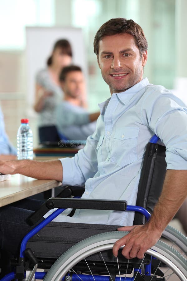 Man in a wheelchair stock image. Image of frontview, work - 29881221