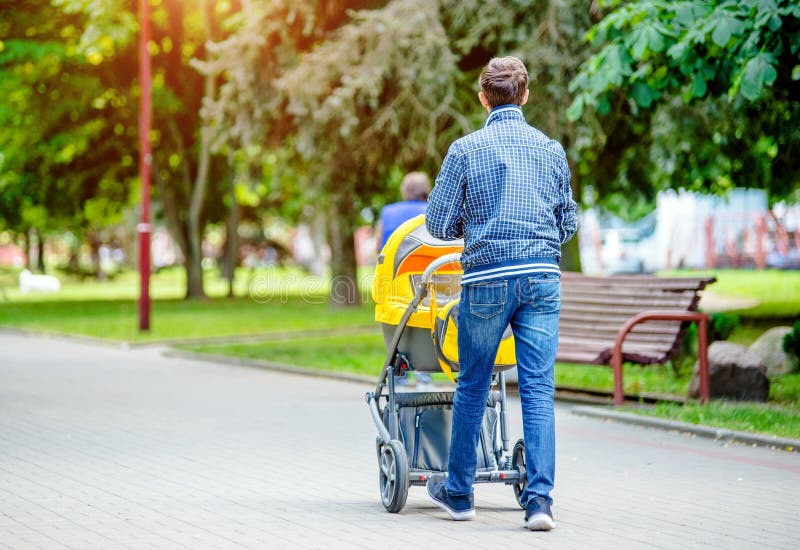 Man wheeling a pram editorial image. Image of pram, life - 192492815