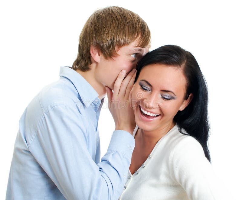 Man whispering to a woman. stock photo. Image of conversation - 27648370
