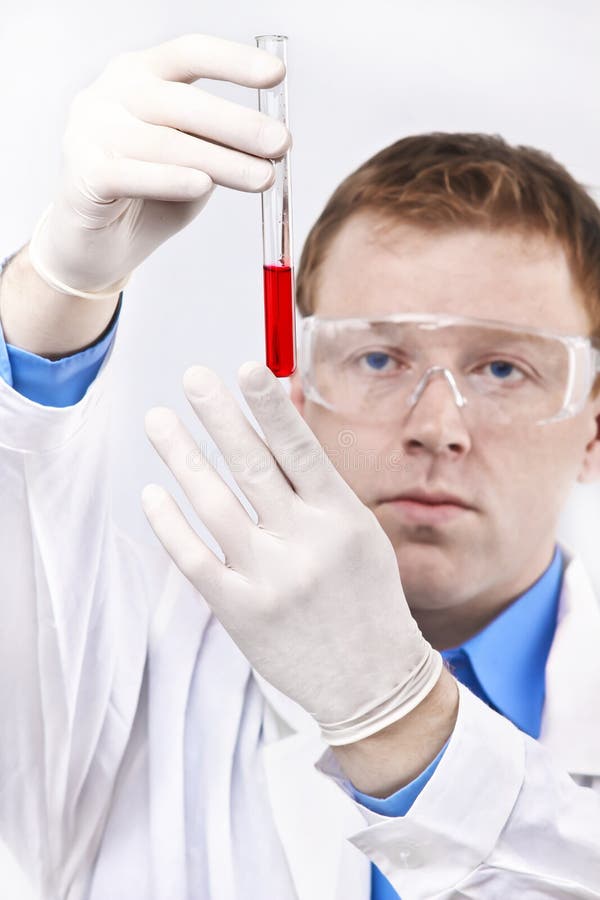 Man in White Coat Looking at a Red Sample Stock Photo - Image of ...