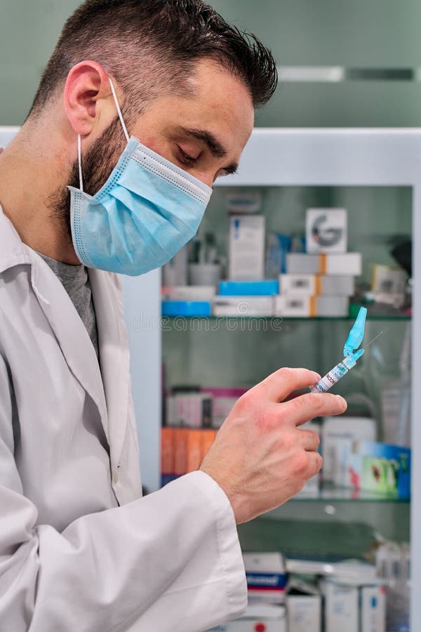 Man in White Coat Manipulating Vaccine Syringe Stock Photo - Image of ...