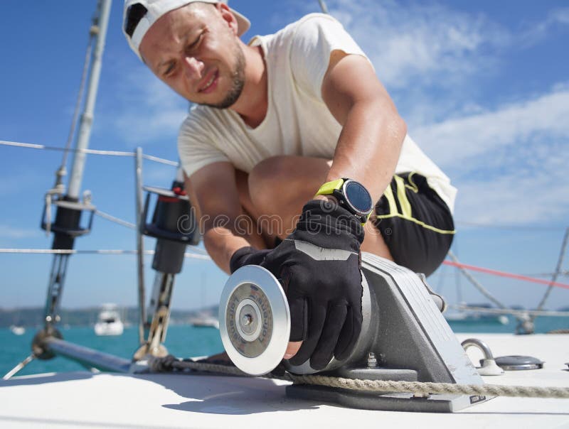 A Man in a White Hat is Working on a Voyage Boat Stock Photo - Image of ...