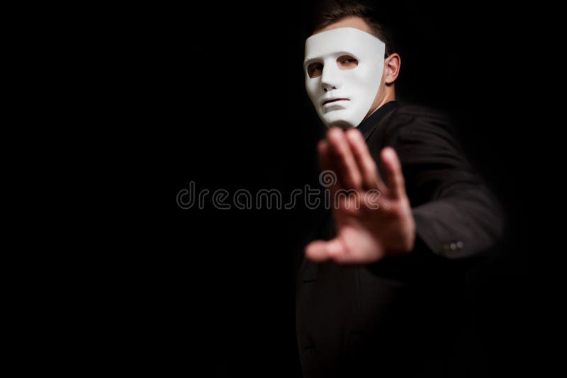 Man in a White Mask on a Black Background Stock Photo - Image of human ...