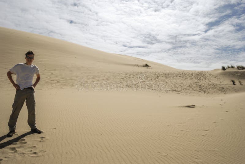 Man in White at the Sand Dunes Stock Image - Image of cloudy, adult ...