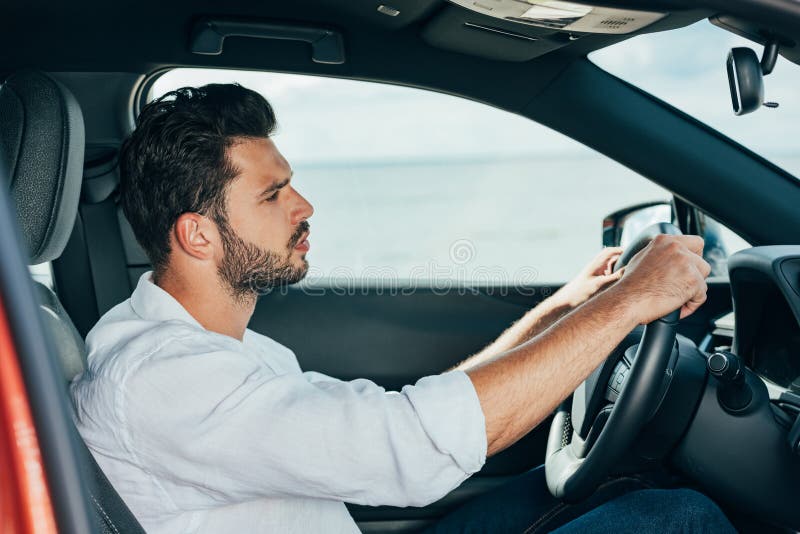 Man in White Shirt Driving Car and Looking Away Stock Photo - Image of ...