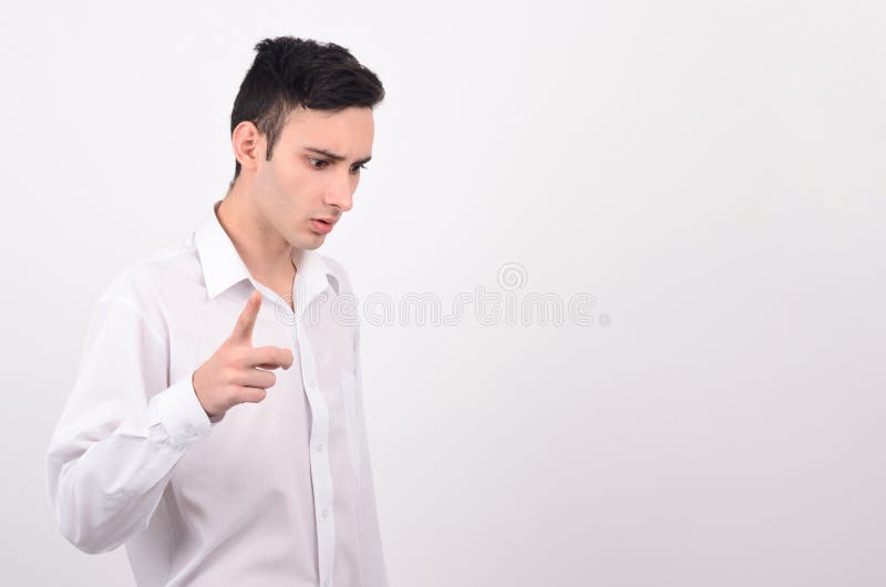 Man in White Shirt Looking Down and Pointing the Finger. Stock Photo ...