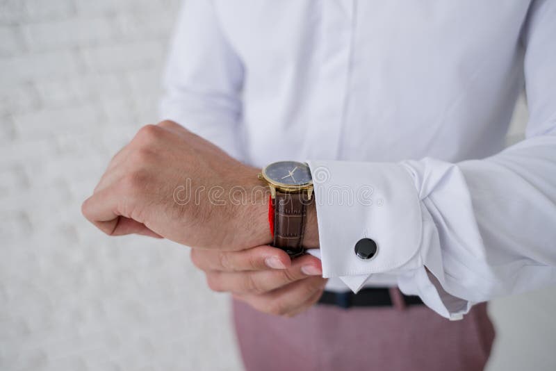 A Man in a White Shirt Puts a Watch Stock Image - Image of stylish ...
