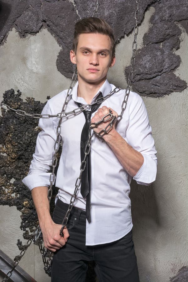 A Man in a White Shirt and Tie Breaks the Chain. Stock Image - Image of ...