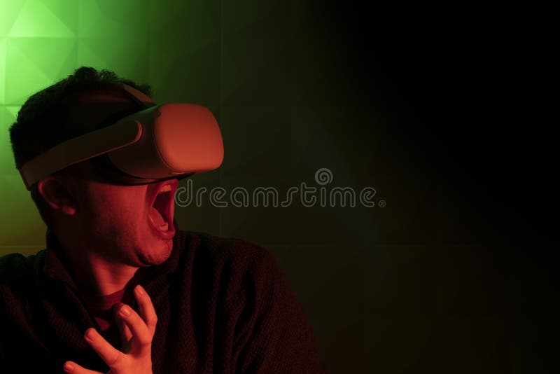 Man in White Virtual Reality Goggles Screaming in Fear in Red Light ...