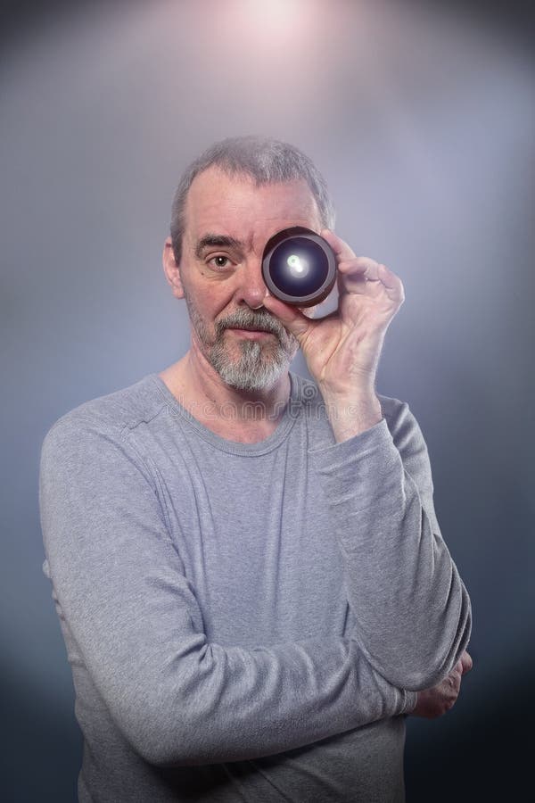 Man Who is Looking through a Camera Lens Stock Photo - Image of looking ...