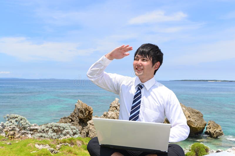 The Man Who Relaxes on the Beach. Stock Image - Image of notebook ...