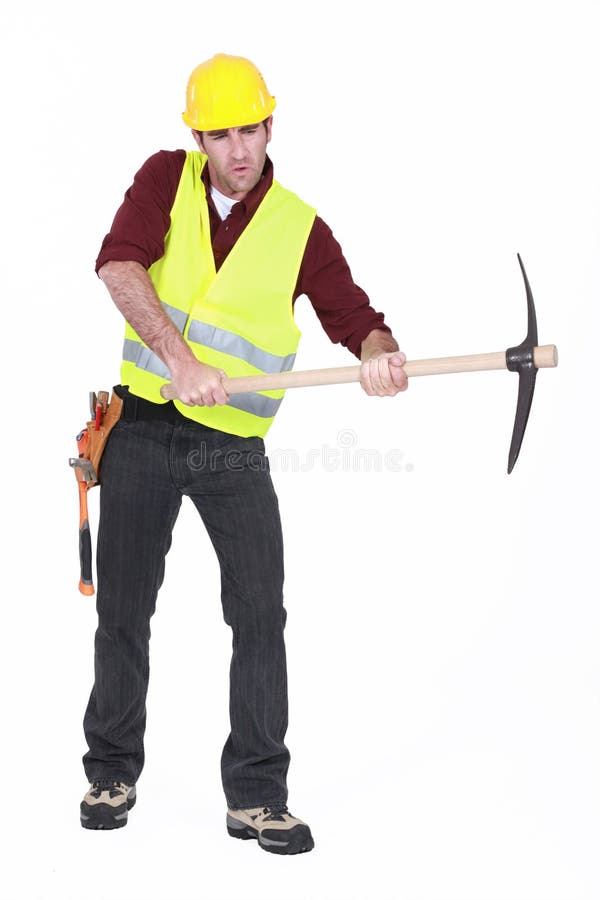 Man wielding pick-axe stock photo. Image of occupational - 28192434