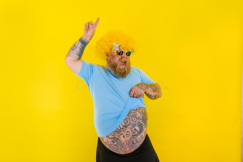 Fat Man with Wig in Head and Sunglasses Dances Stock Image - Image of ...