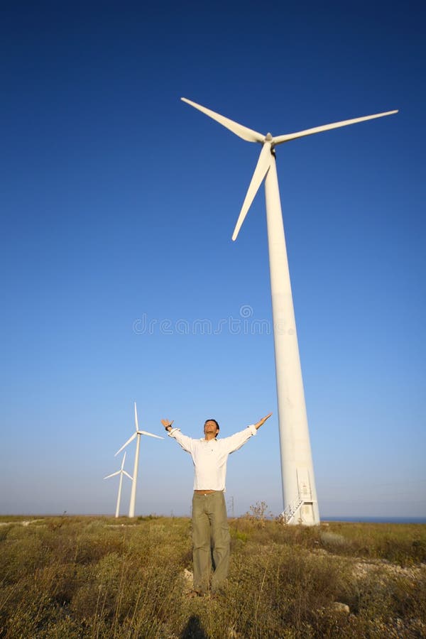 Man and wind turbines stock image. Image of turbine, supply - 11334849