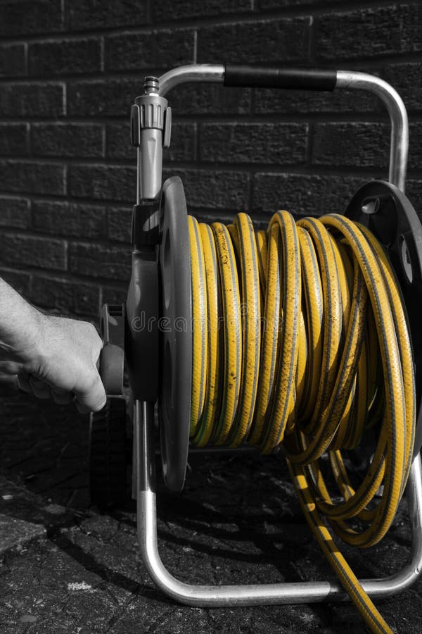 Man Winding Hose Pipe Reel Stock Photos - Free & Royalty-Free Stock ...